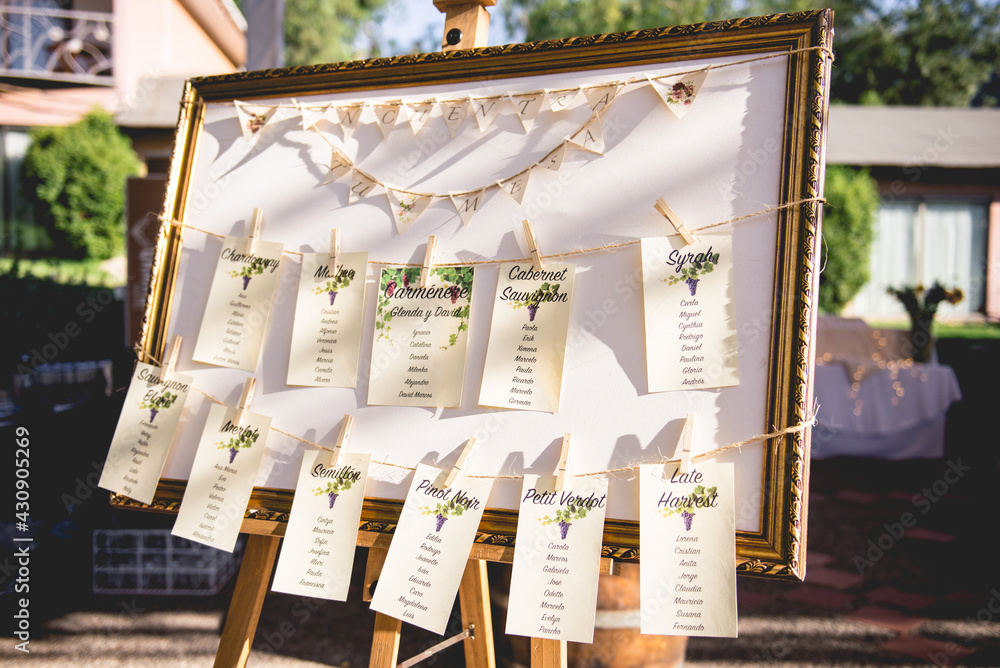 Beautiful board with labels with the order of the tables in a wedding ...