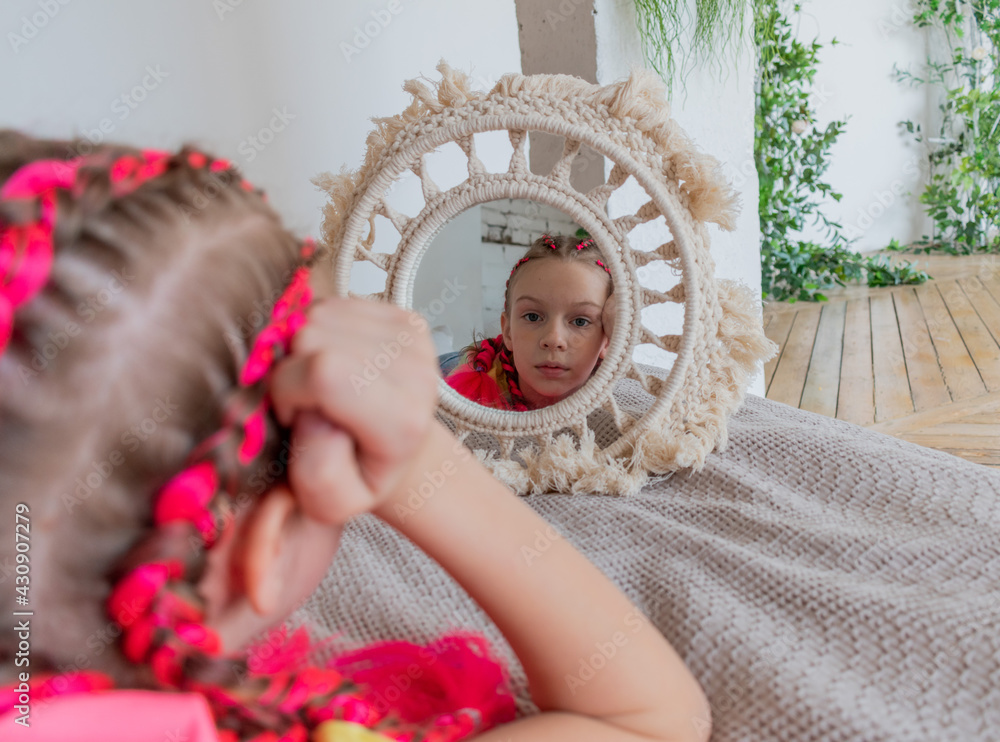 Teenage girl look her reflection in mirror. Concept of studying your ...
