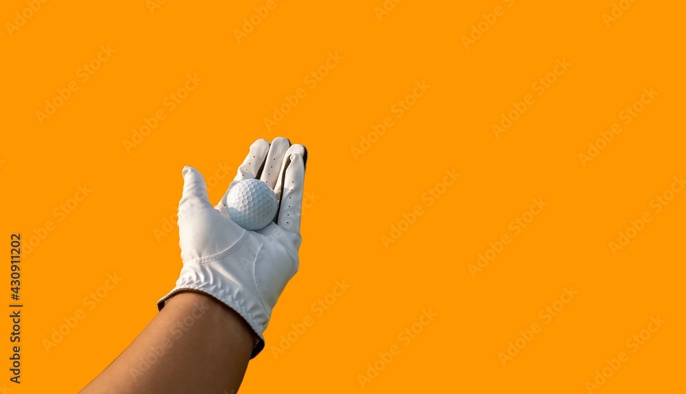 Golfer wearing golf glove showing golf ball on hand holding with orange ...