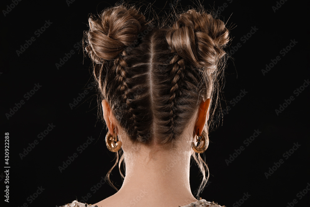 Beautiful young woman with braided hair on dark background Stock Photo ...