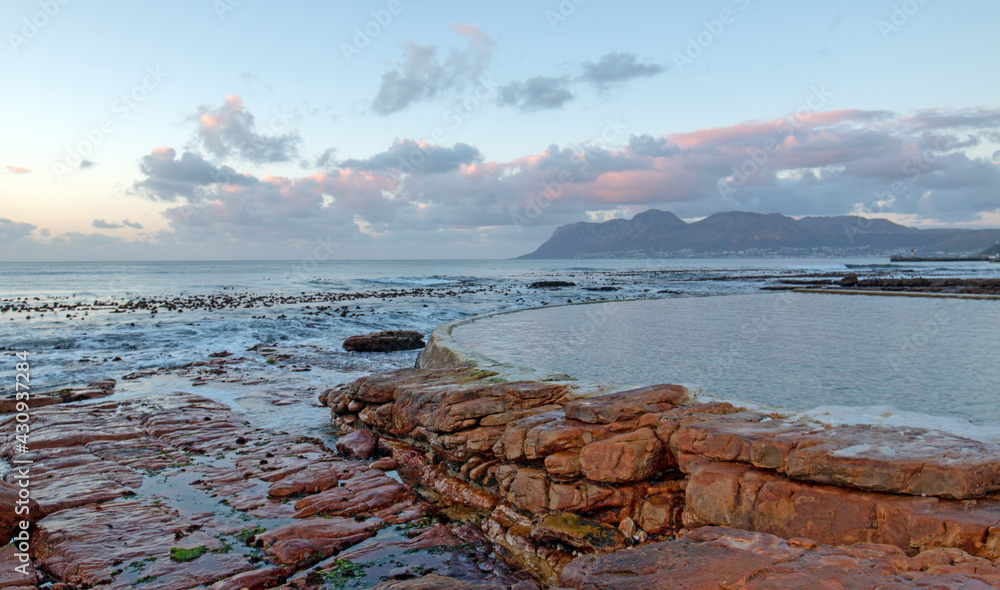 Rock jetty seawall at Dale Brook tidal swimming pool at Cape Town South ...