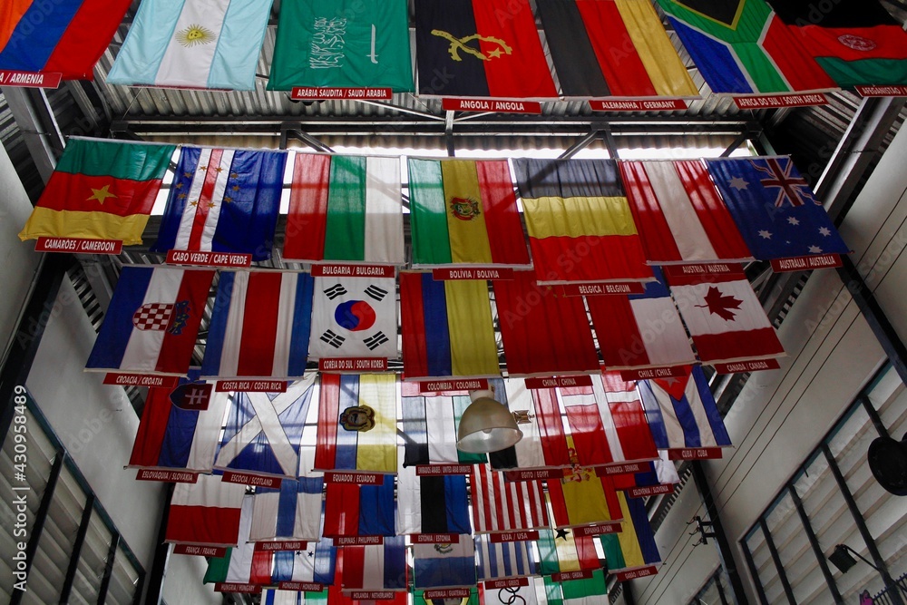 Flags from around the world hanging between buildings Stock Photo ...