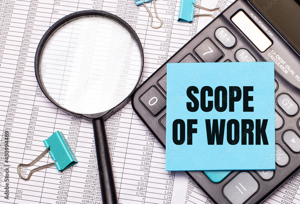 On the table are reports, a magnifying glass, a calculator, and a blue ...