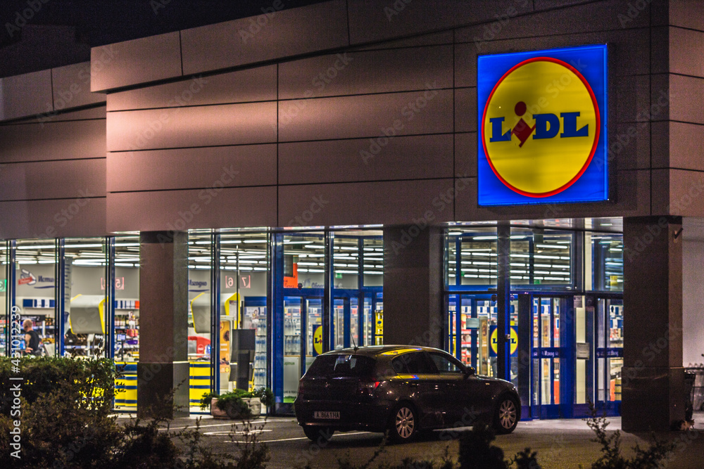View of Lidl supermarket and logo in the night.Lidl Stiftung & Co. KG ...