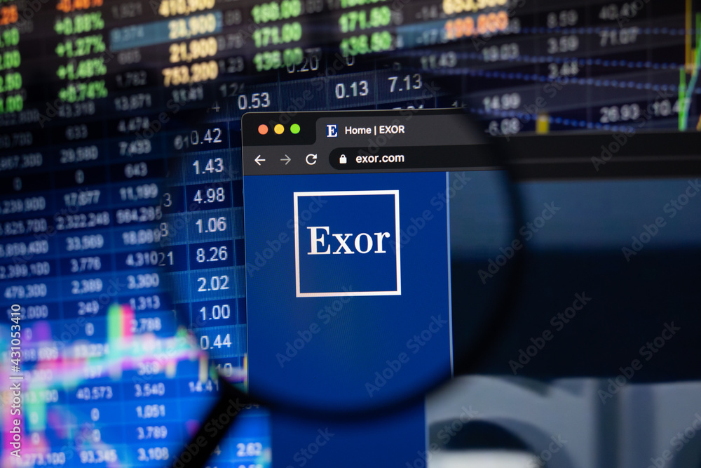 Exor company logo on a website with blurry stock market developments in ...