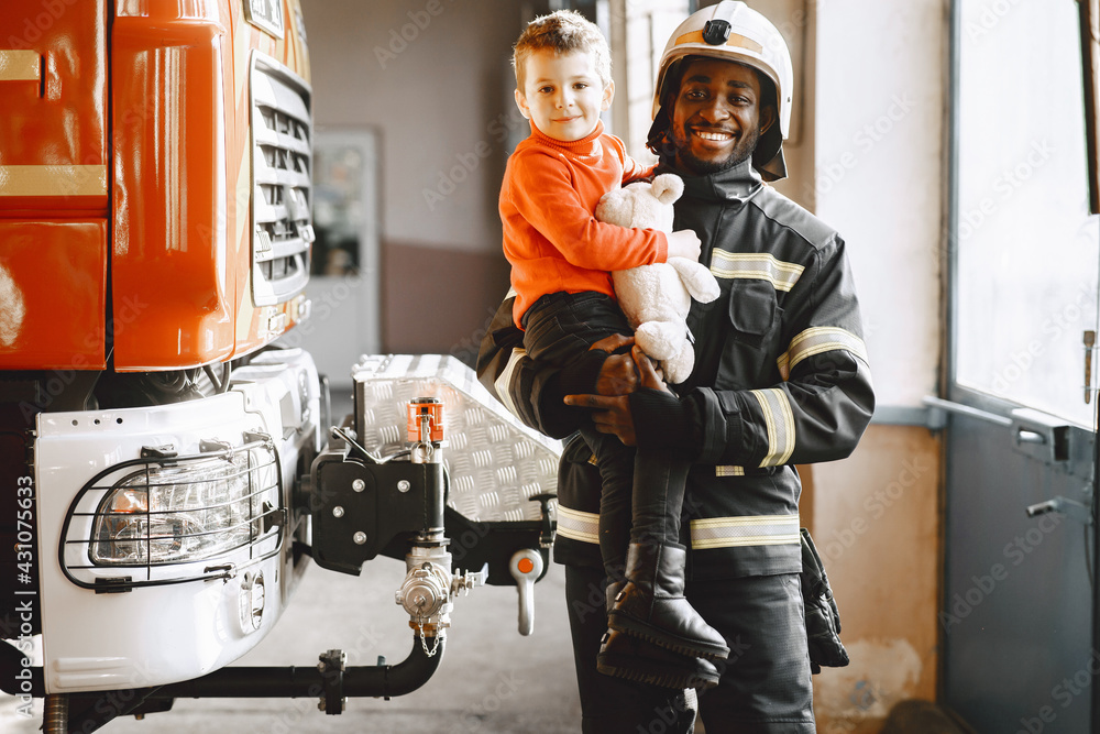 Portrait of a firefighter standing in front of a fire engine Stock ...