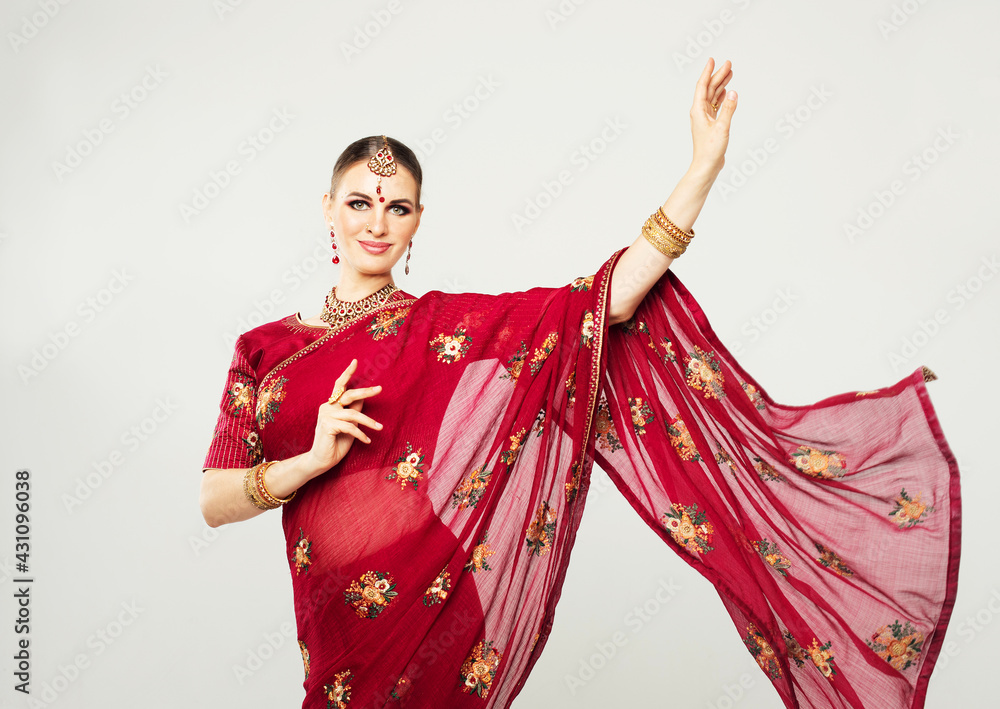 indian woman in traditional clothing dancing over grey background Stock ...