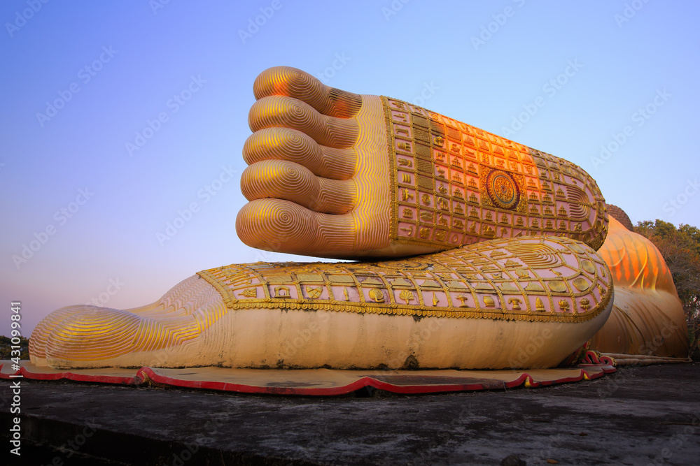 big buddha footprint and many symbol on the foot with clear sky in wat ...