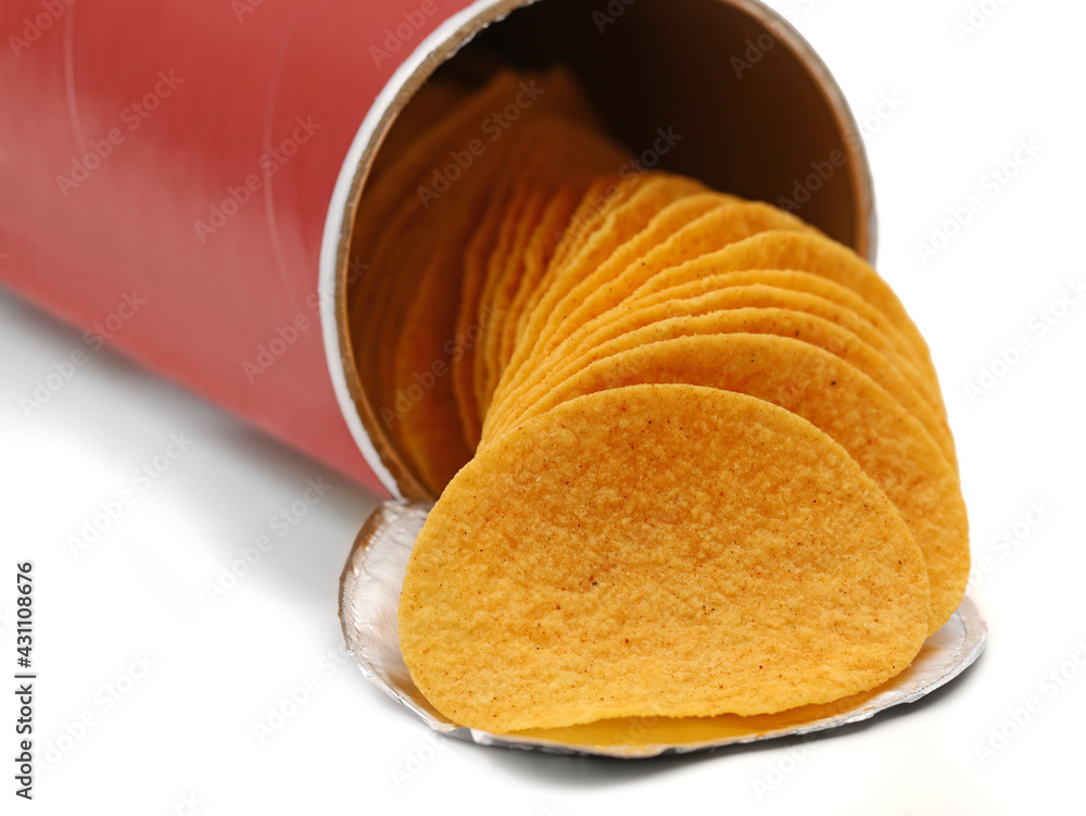 stacked crisps falling out from red cardboard tube, paprika flavoured ...