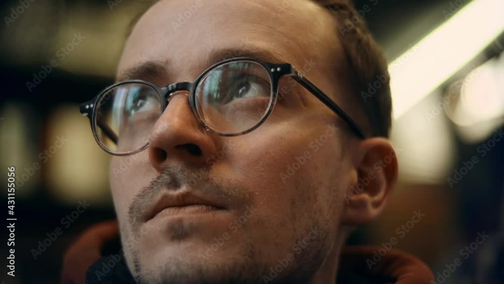 Portrait of an intelligent educated man wearing glasses. The guy thinks ...