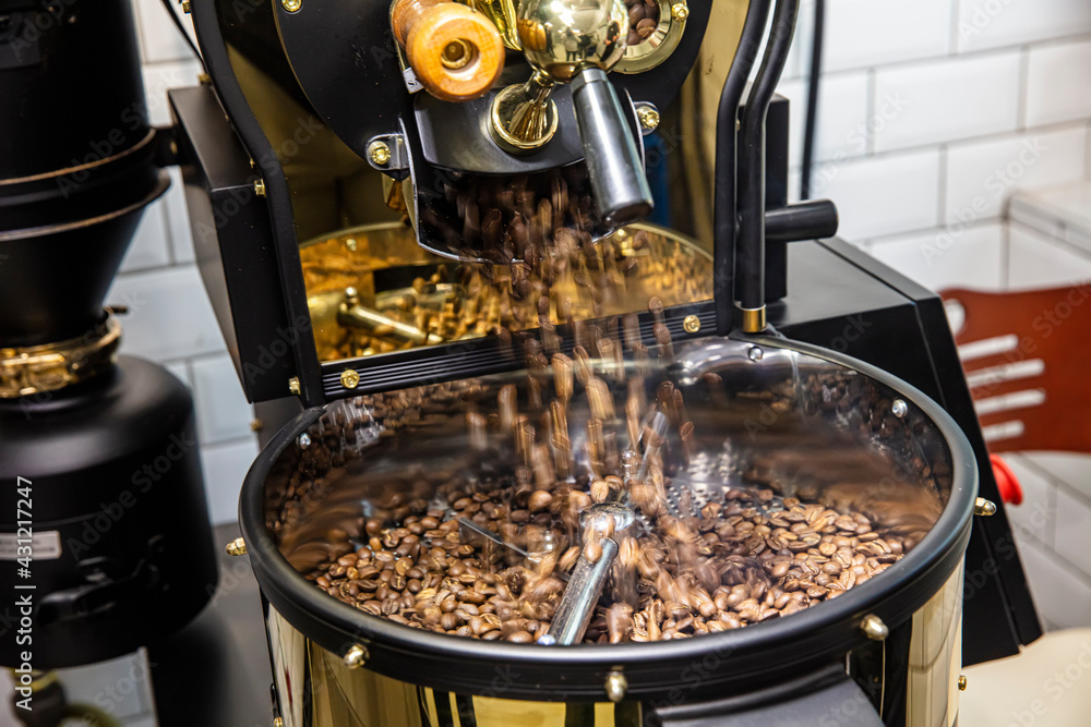 Coffee Roaster. Roasting coffee beans hand close up..Top view near ...
