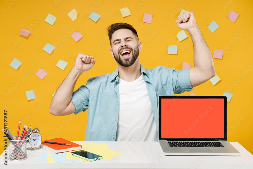 Young excited overjoyed successful employee business man wear shirt sit ...