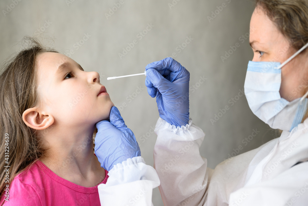 COVID-19 PCR test and kid, nurse holds swab for nasal sample from ...