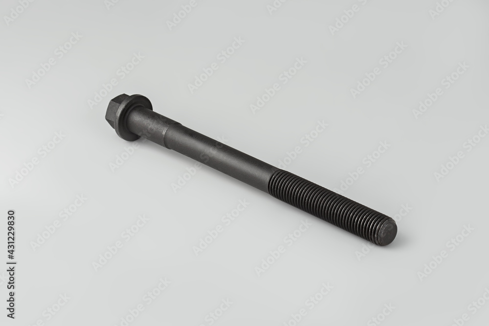 The crankshaft mounting bolt on a gray background. Cylinder head ...