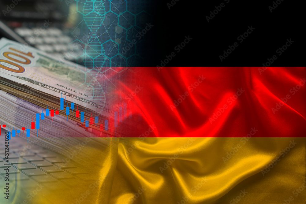 national flag of Germany on satin, dollar bills, computer, concept of ...