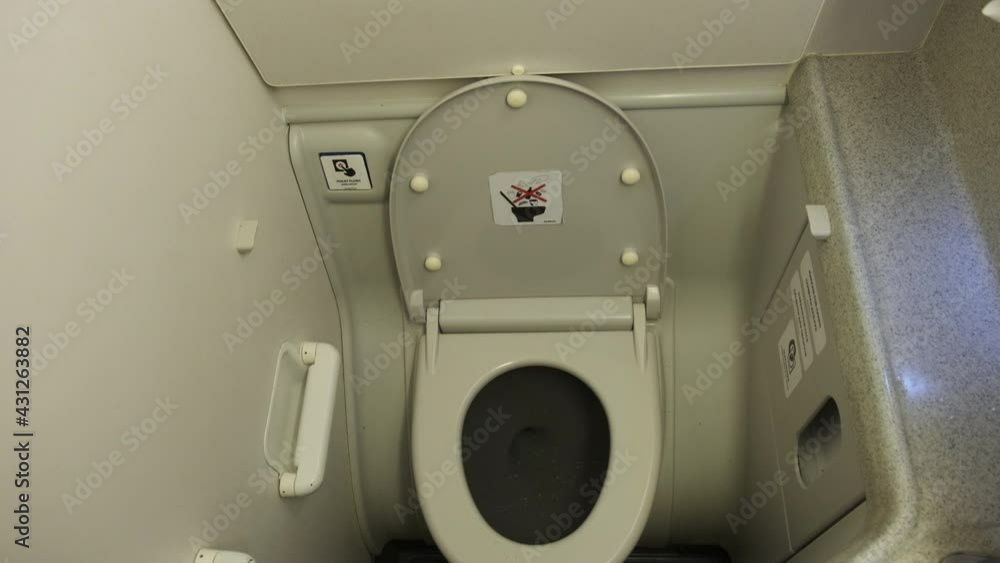 Toilet in the plane. Airplane bathroom. Small, compact, public modern ...