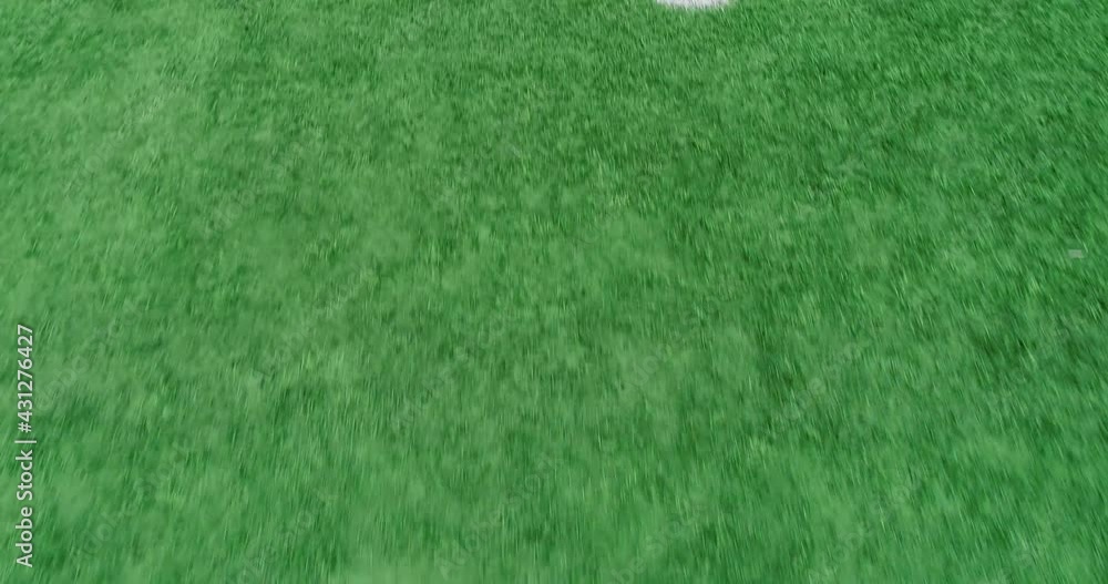 Overhead shot of the texture of the artificial grass of a sports field ...