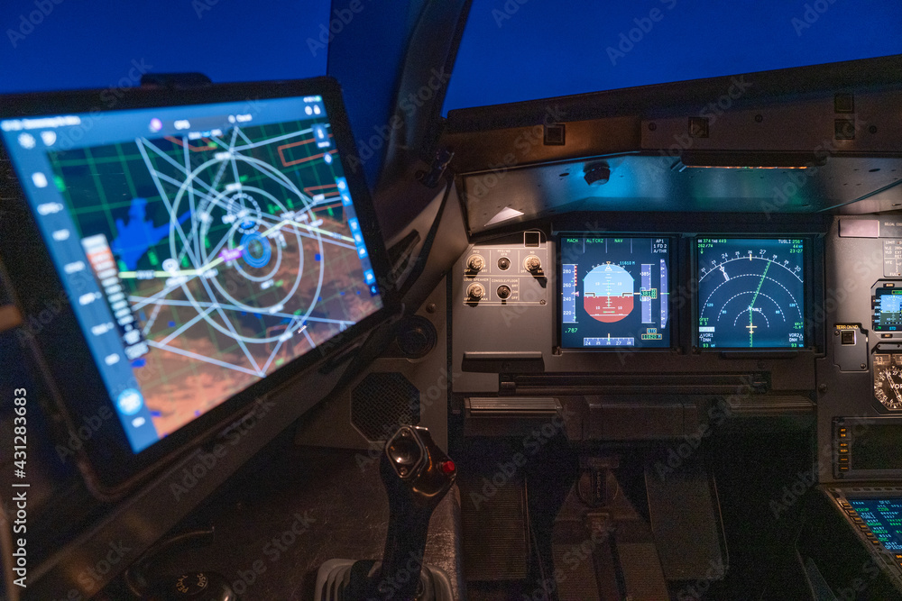 modern cockpit of an jet airplane during night flight in Chinese ...