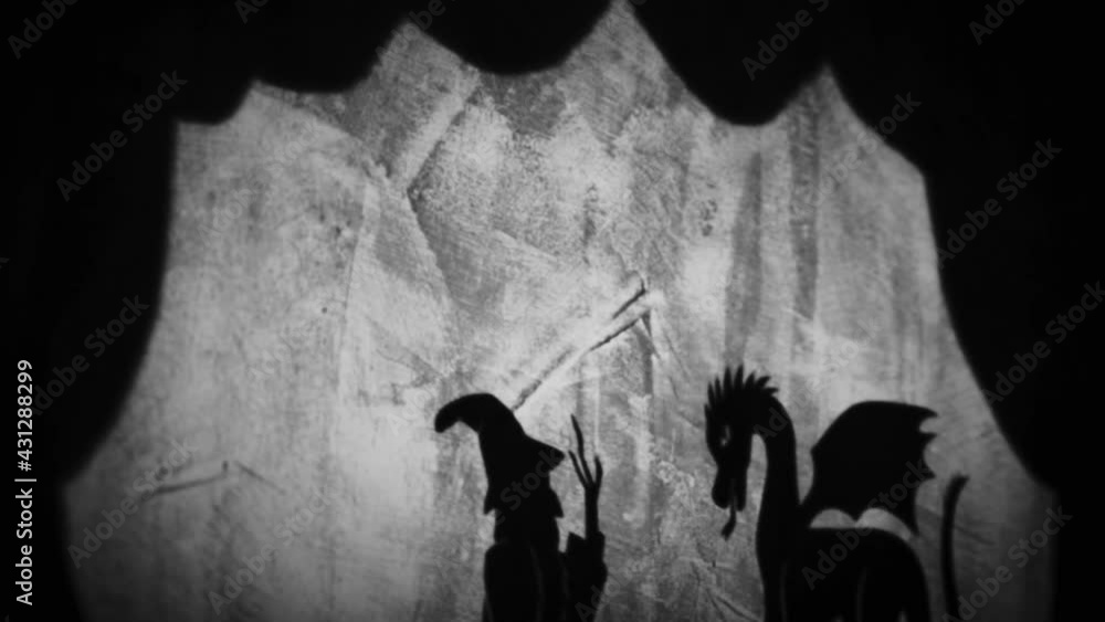Vintage animation, shadow theatre on a wall. Pantomime, fantasy story ...
