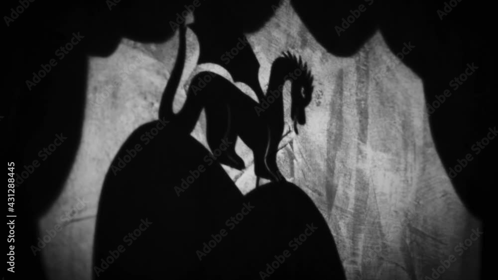 Vintage animation, shadow theatre on a wall. Pantomime, fantasy story ...
