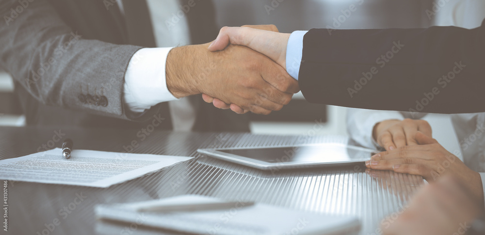 Handshake as successful negotiation ending, close-up. Unknown business ...