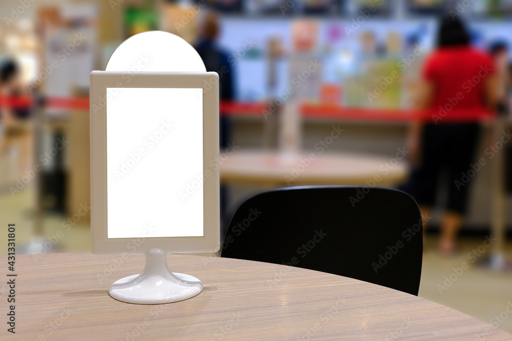 Blank retail POS display in restaurant for advertising mockup purpose ...