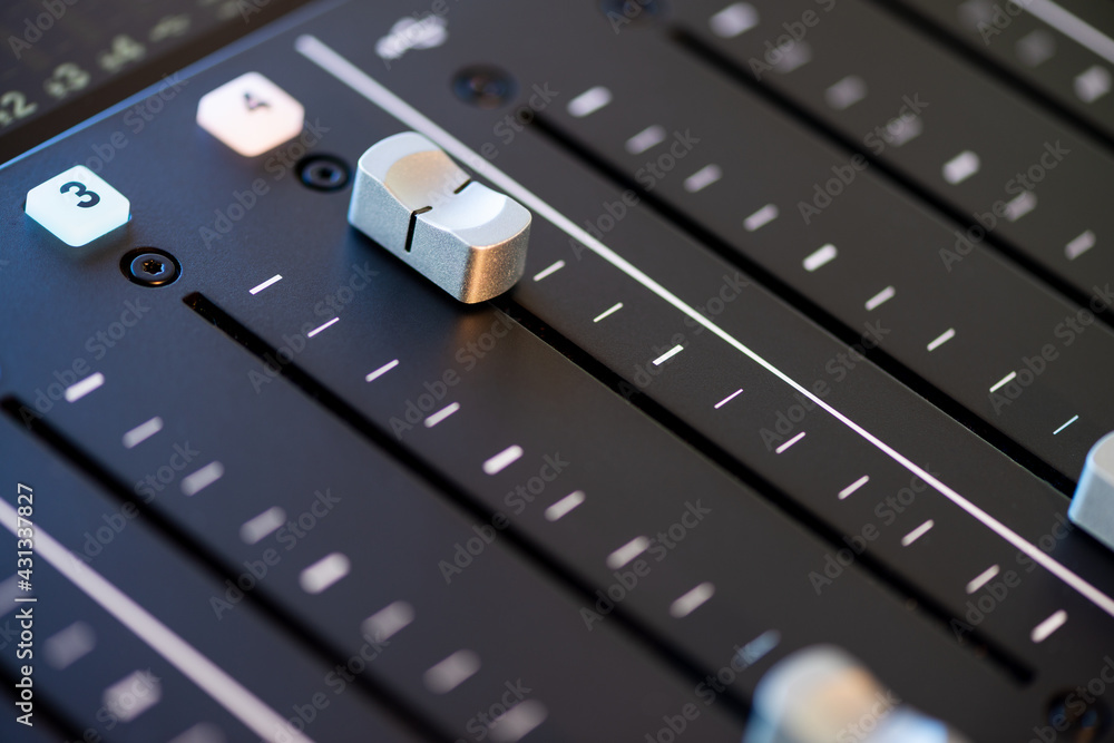 Professional podcast mixing console with faders and adjusting buttons ...