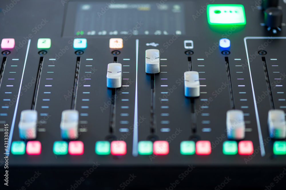 Professional podcast mixing console with faders and adjusting buttons ...