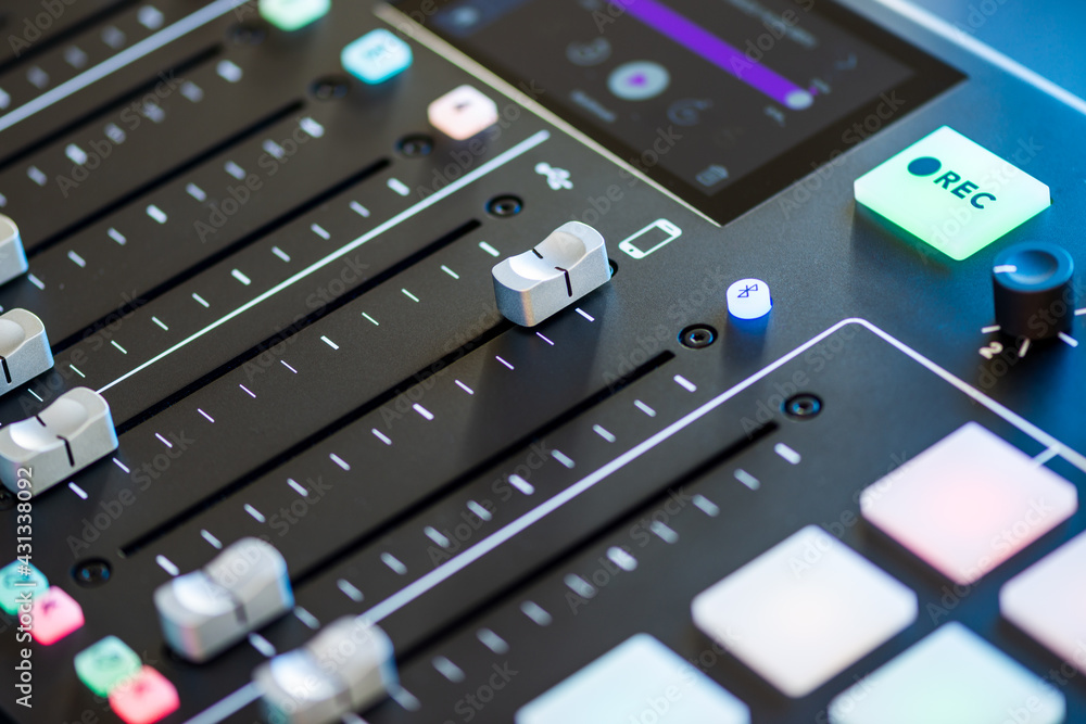 Professional podcast mixing console with faders and adjusting buttons ...