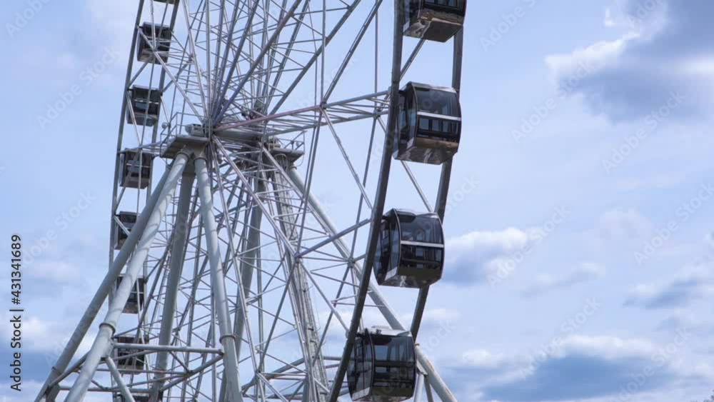 Ferris Wheel attraction. The mechanism of rotation of the wheel close ...