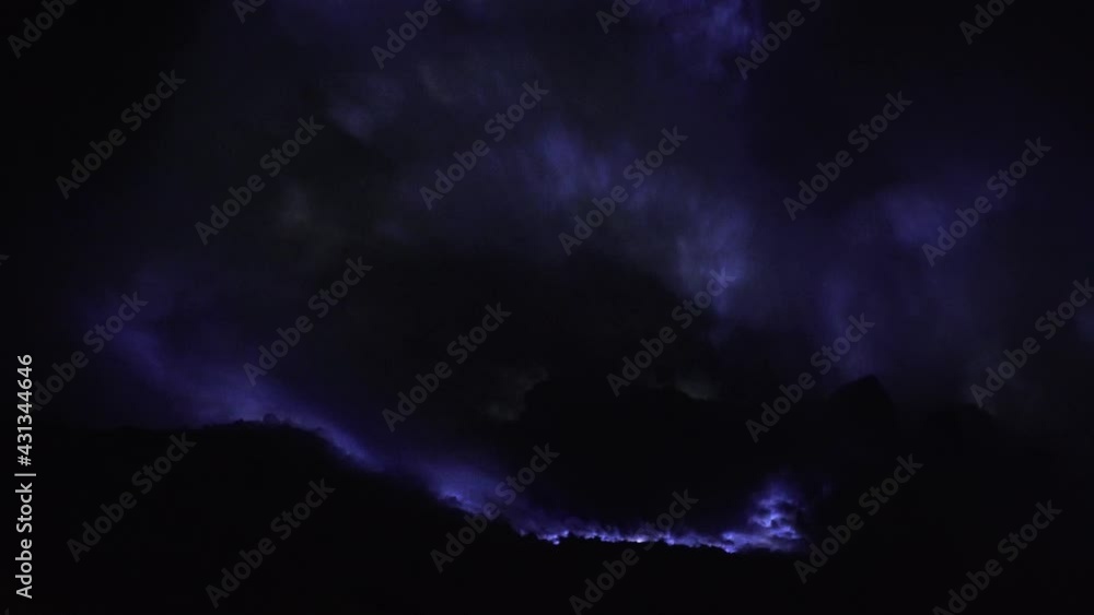 Blue fire of burning sulfur in a crater of a volcano Kawah ijen, Java ...