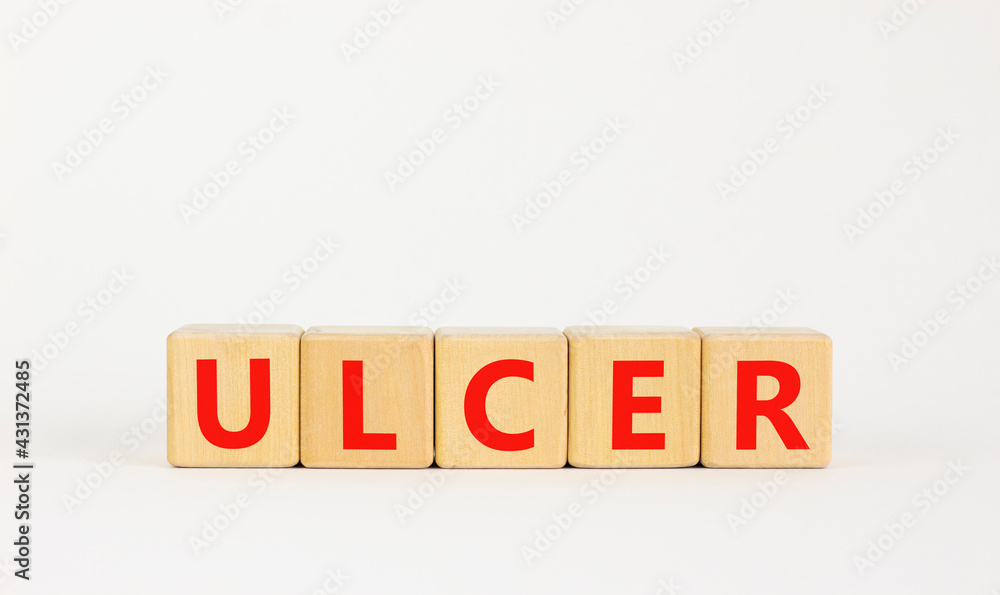 Stomach ulcer symbol. Wooden cubes with words 'Stomach ulcer ...