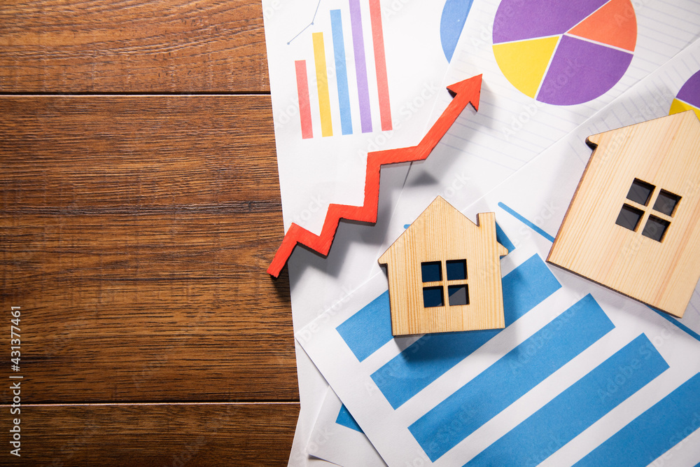 House model and red arrow graph. Stock Photo | Adobe Stock