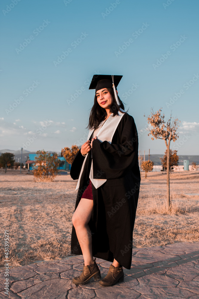 GIRL WITH BLACK TOGA AND WHITE STOLE Stock Photo | Adobe Stock