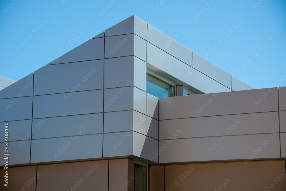 The exterior wall of a contemporary commercial style building with ...