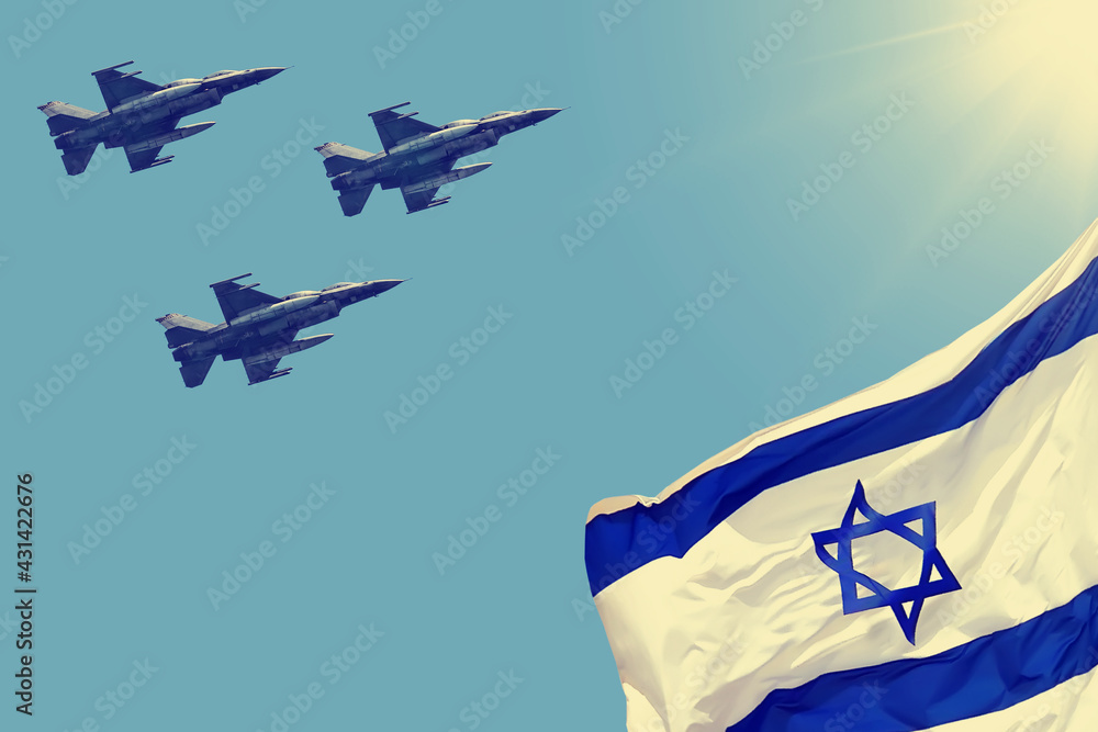 Israeli National waving flag and Military fighter jets against blue sky ...