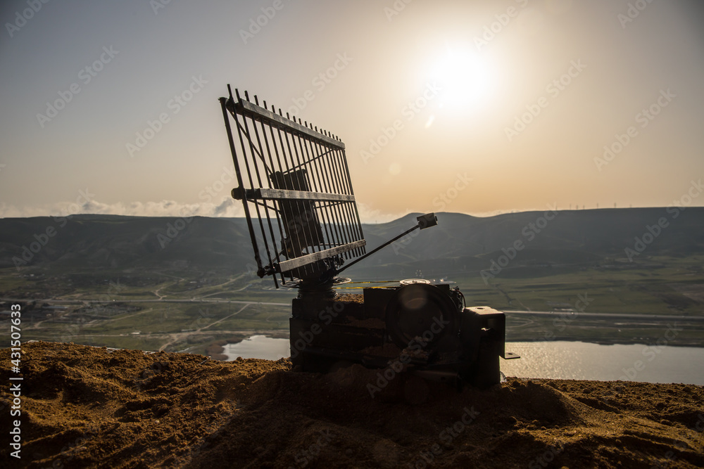 Space radar antenna on sunset. Silhouettes of satellite dishes or radio ...