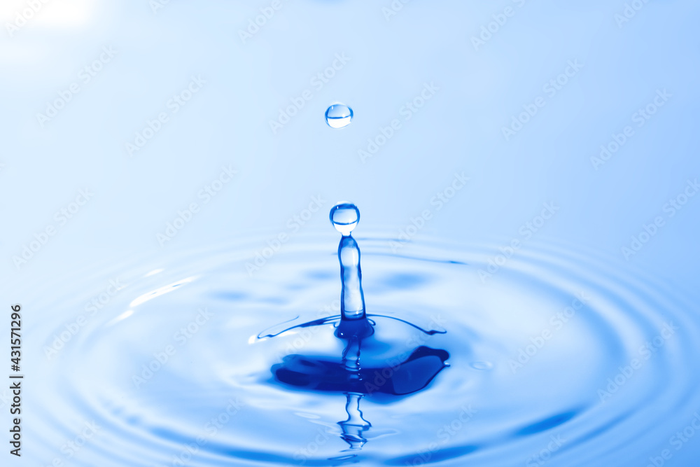 Drop of water. Water droplet falling impact with water surface. causing ...
