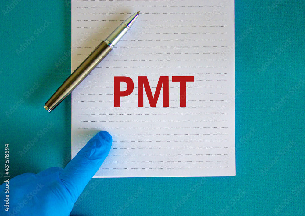 Medical and PMT, premenstrual tension symbol. Pen. White note with the ...