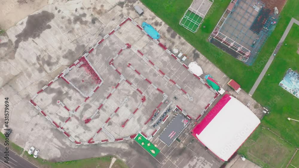 Aerial top view of the empty go-kart track. Kart racing or karting is a ...
