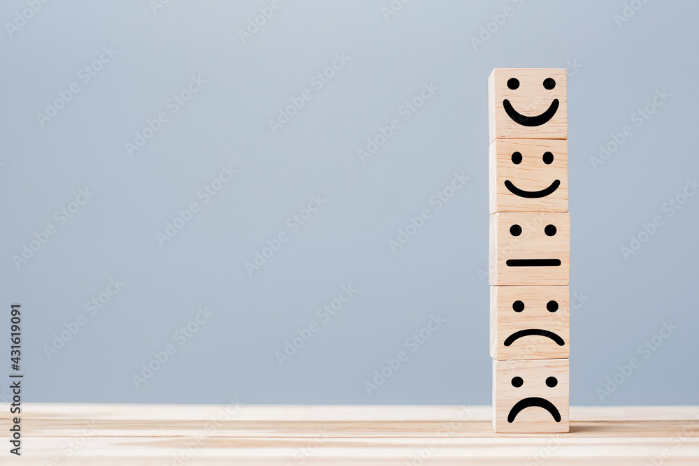 smile face symbol on yellow wooden cube blocks. Emotion, Service rating ...