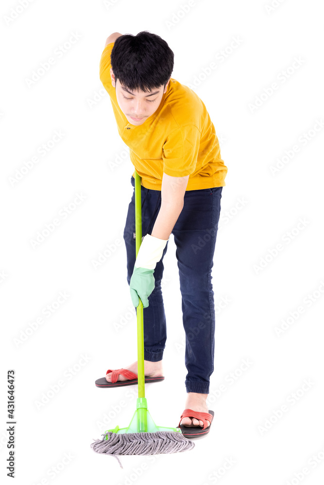 Asian teen boy cleaning floor with mop. Young child doing house chores ...