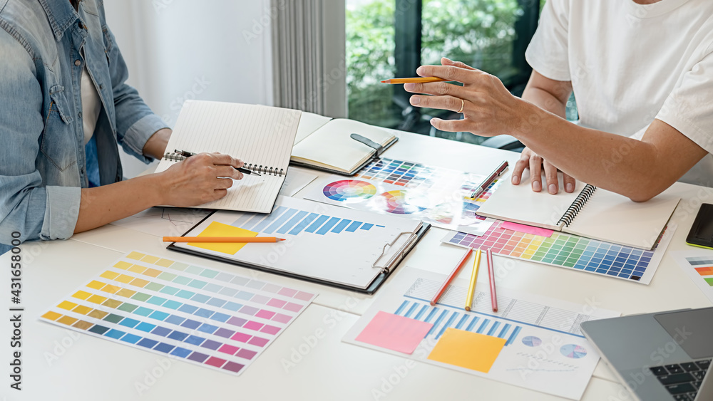 Graphic design and color swatches and pens on a desk. Architectural ...