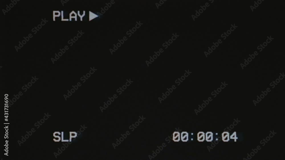 An old bad VHS tape playing. Old black screen with PLAY text and ...