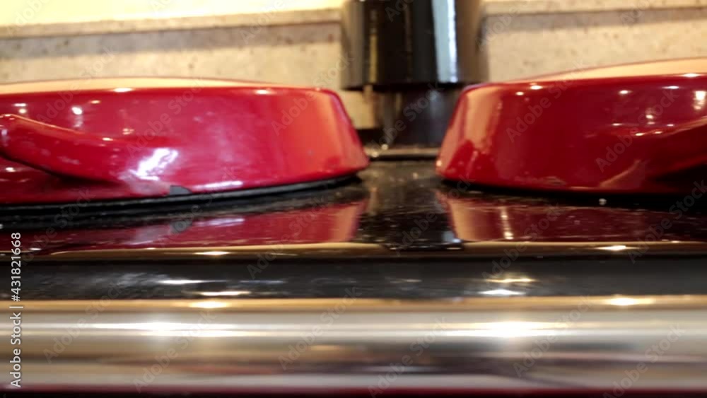 Camera moves across the top of a beautiful red Aga cooker room a ...