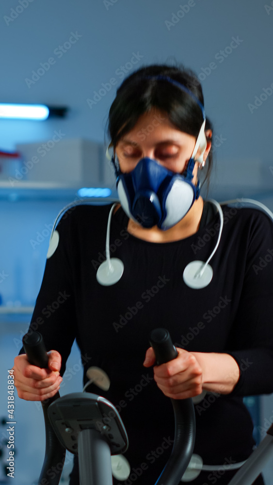 Team of doctor researchers monitoring endurance of woman performance ...