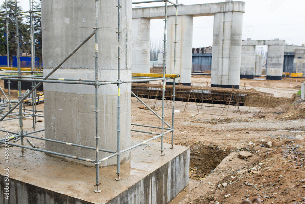 Scaffolding on the concrete foundation of the reinforced concrete ...