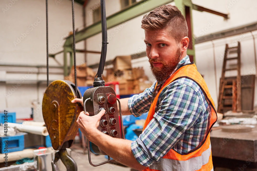 Worker as a machinist at the control panel of a machine Stock Photo ...