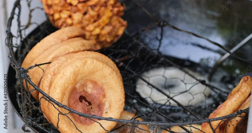 Chinese doughnuts (also called salty doughnut and mianwo) on pan grill ...