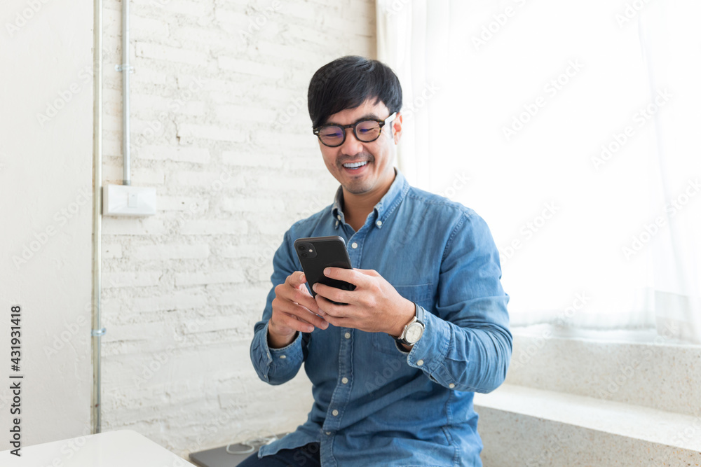 Asian Guy On Cell Phone